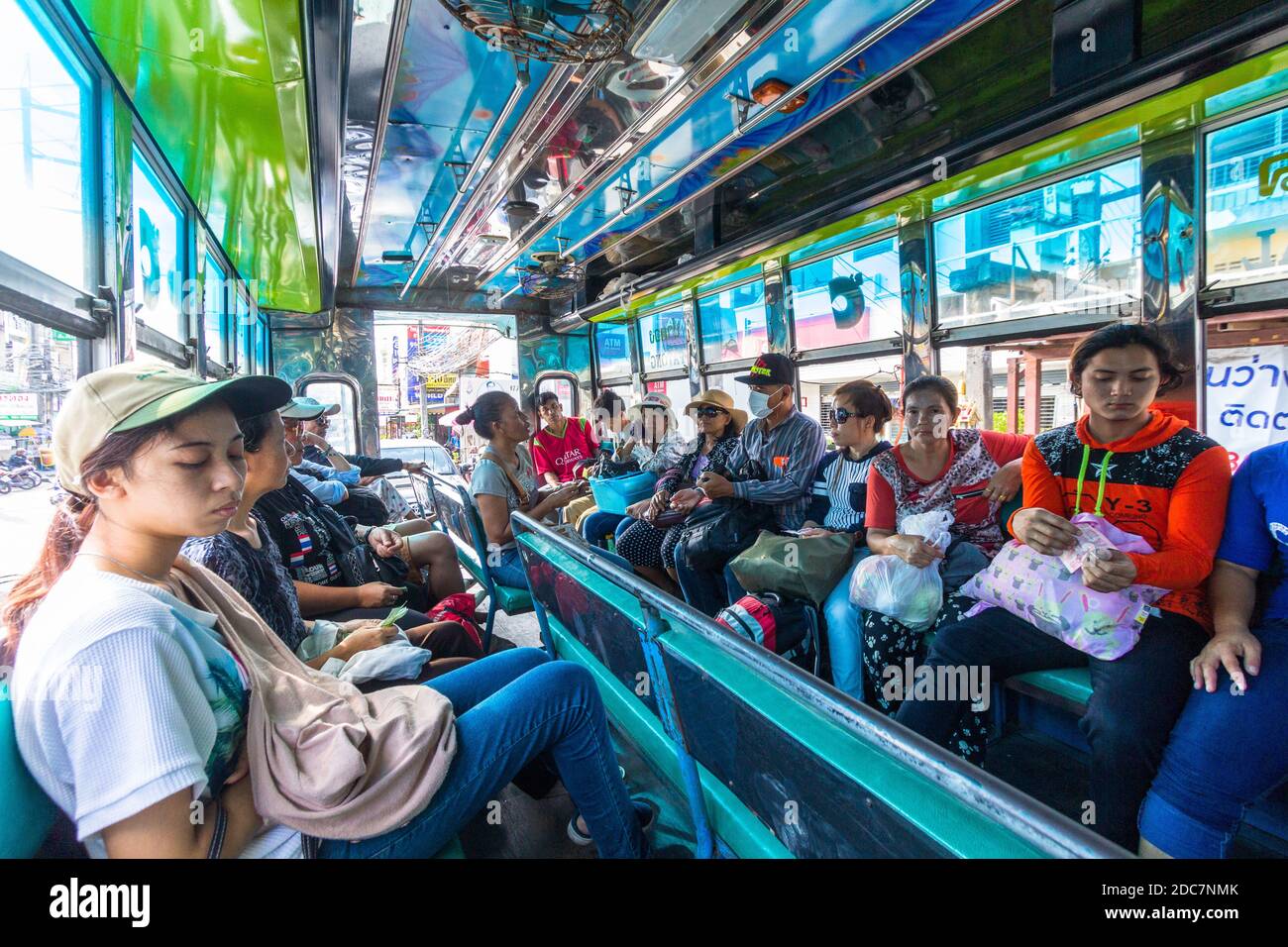 Passengers inside a songthaew Stock Photo - Alamy