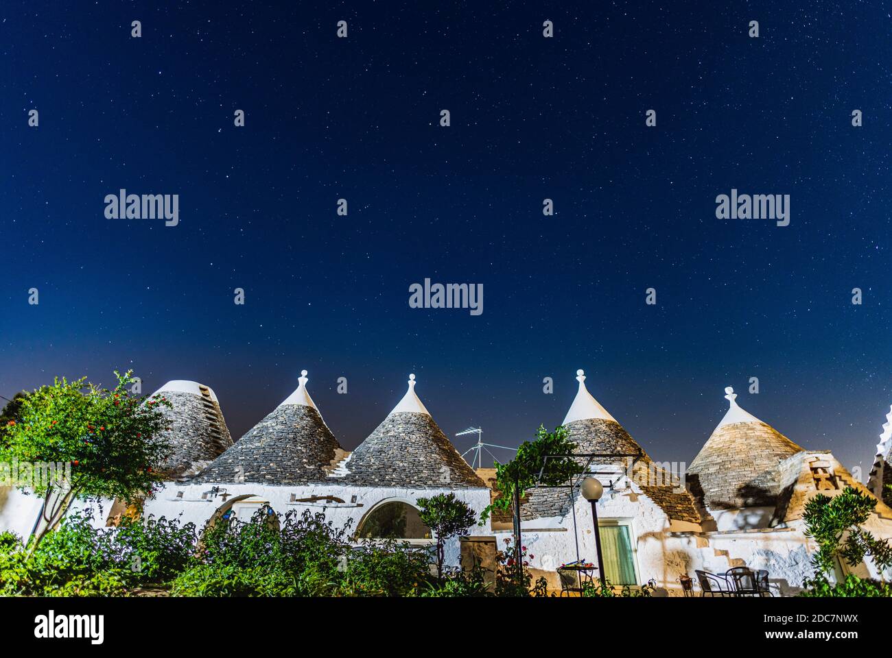 Olive trees and trulli of the Itria valley. Puglia Stock Photo - Alamy