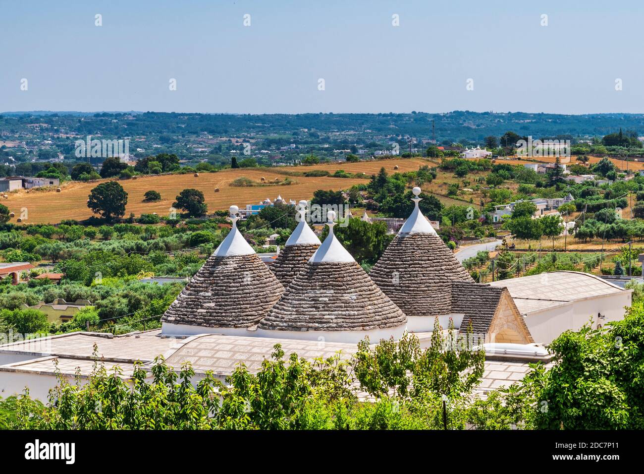 Olive trees and trulli of the Itria valley. Puglia Stock Photo - Alamy