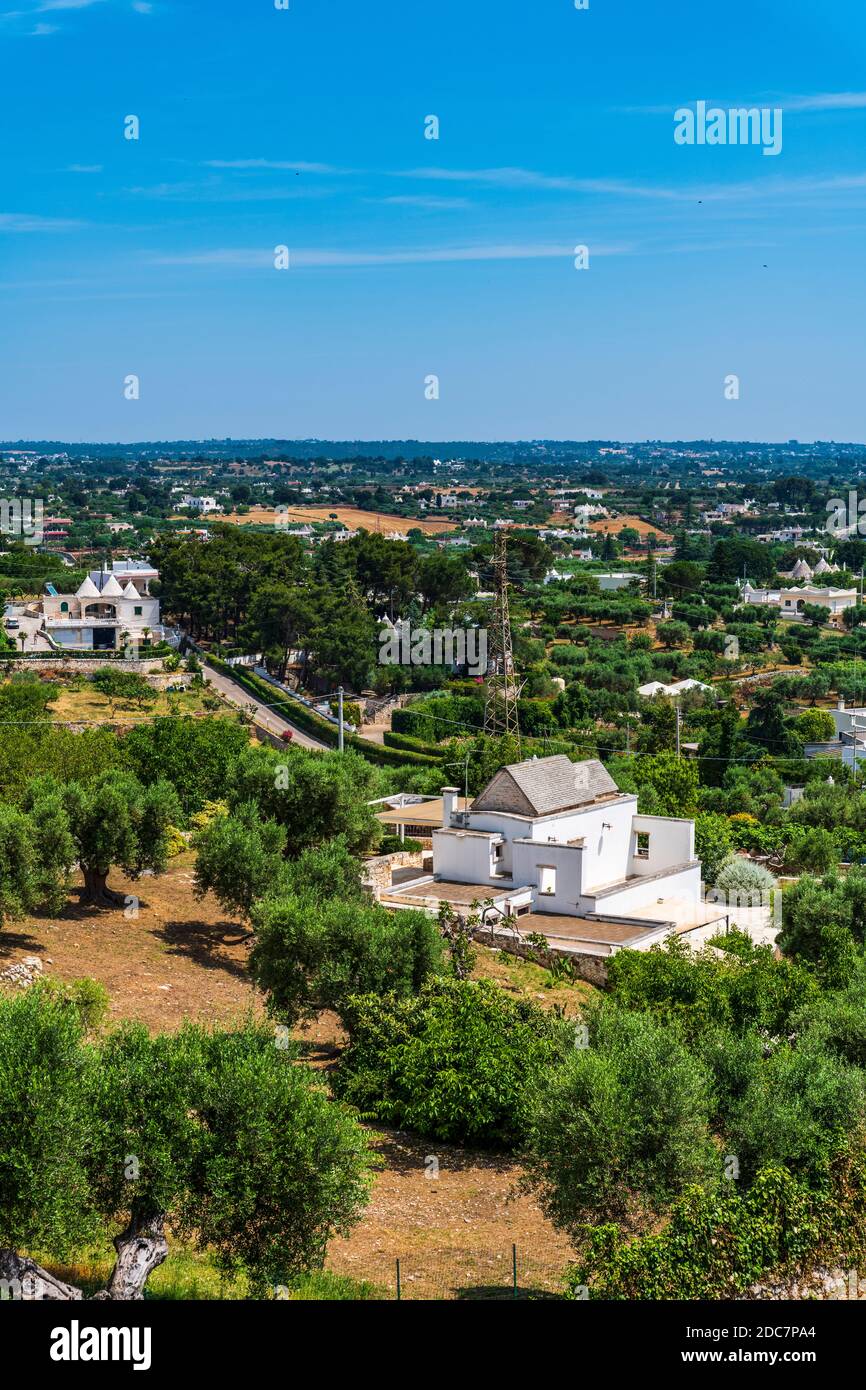 Olive trees and trulli of the Itria valley. Puglia Stock Photo - Alamy