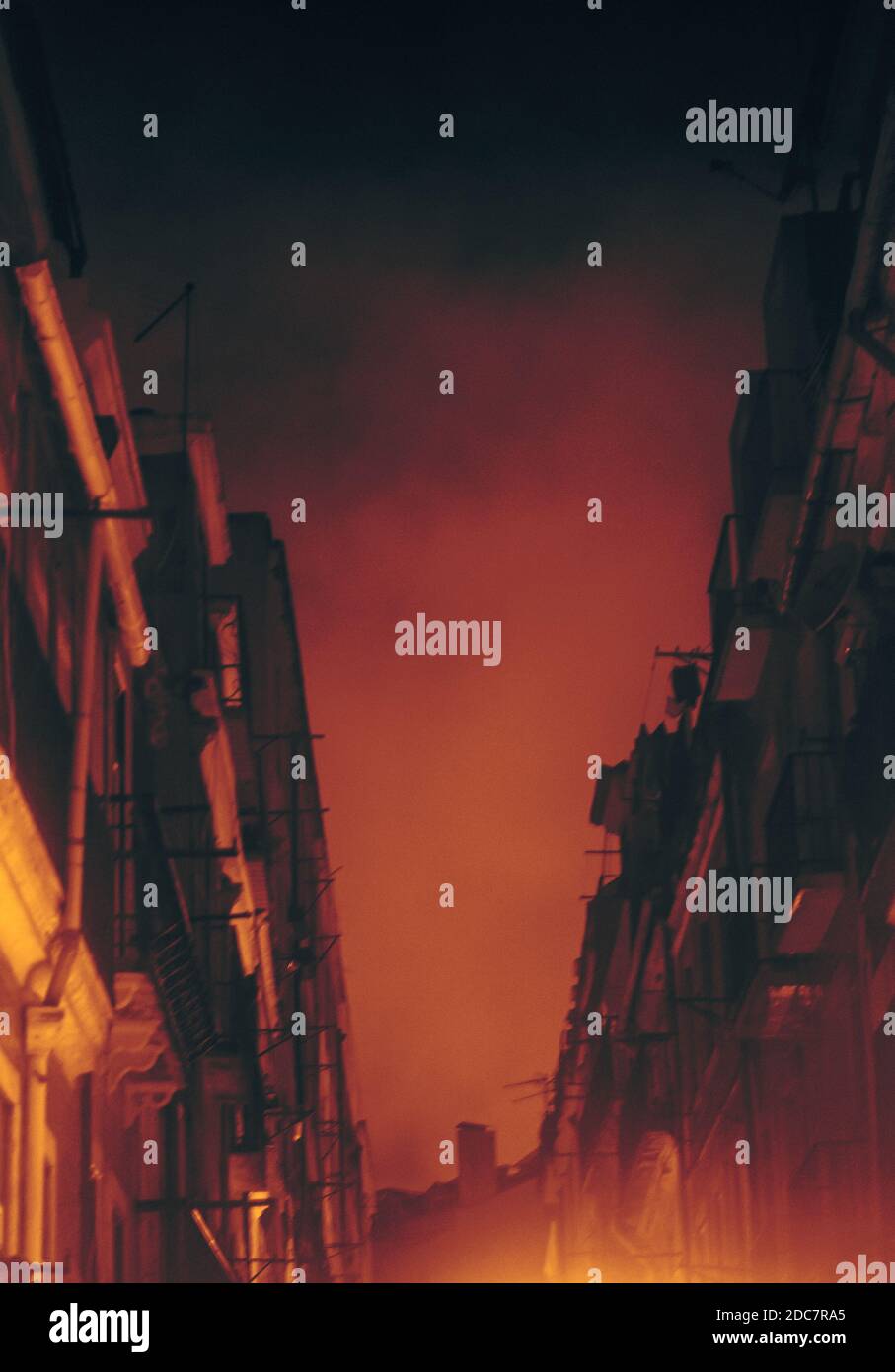 Dramatic red sky in between residential buildings Stock Photo - Alamy