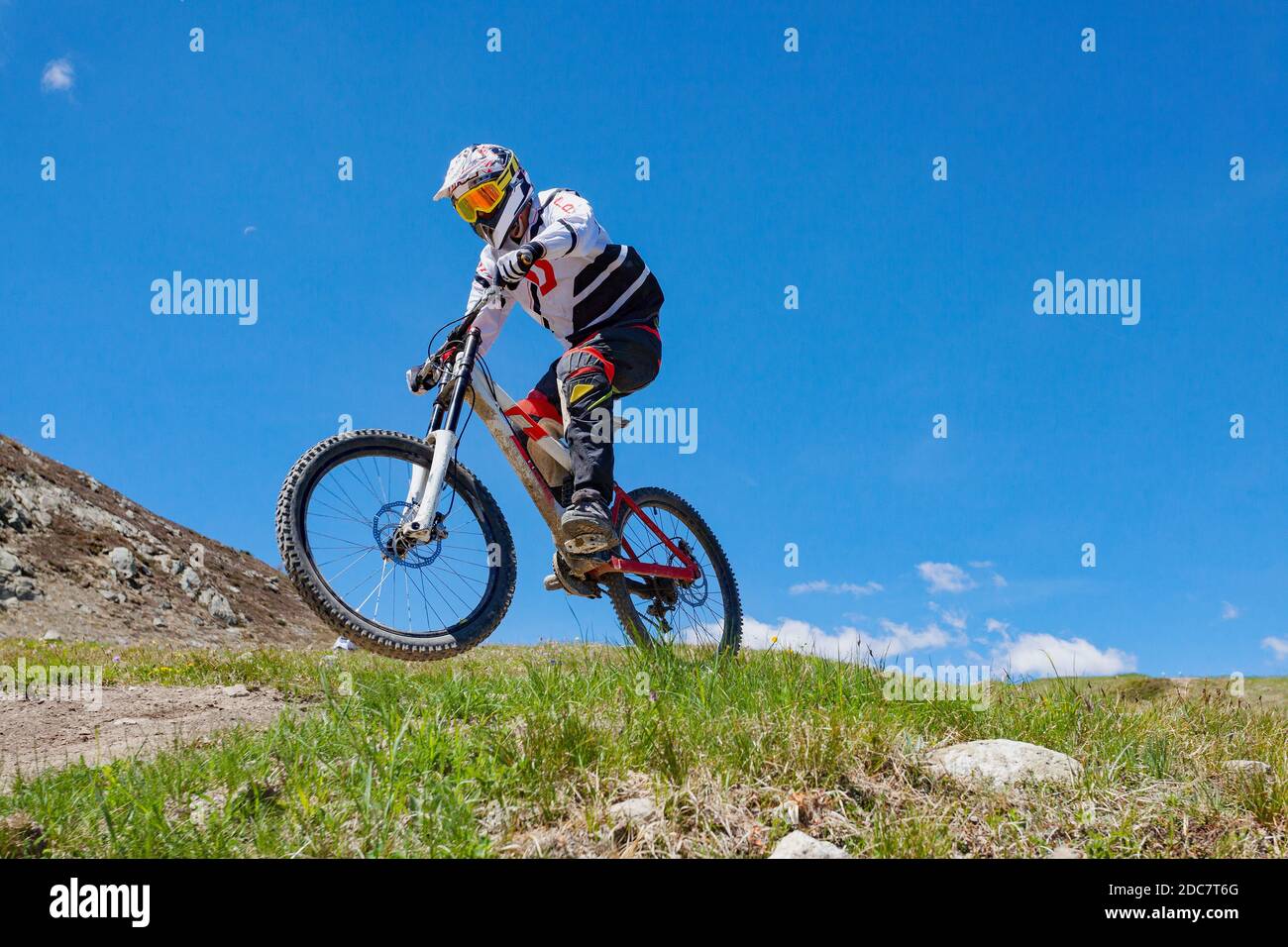 athlete running downhill with mountain bike in the high mountains Stock ...