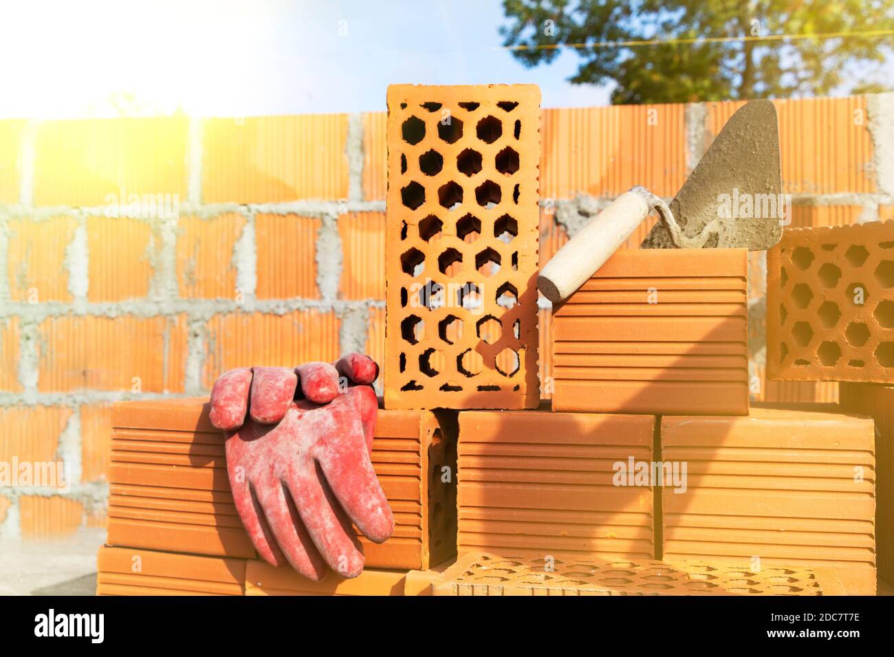 Mason bricklaying background with trowel and clay brick blocks Stock ...