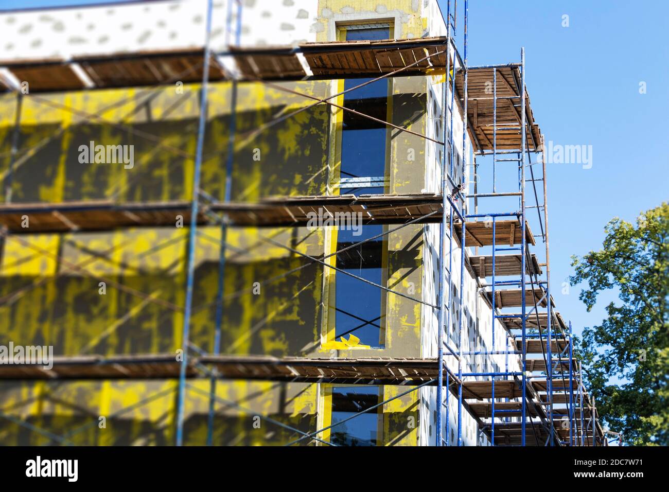 Insulation of walls, installation of scaffolding, high-rise work ...