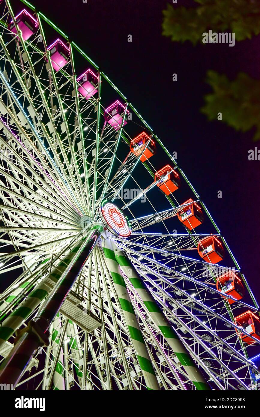 neon carnival amusement park ride lights at night Stock Photo - Alamy