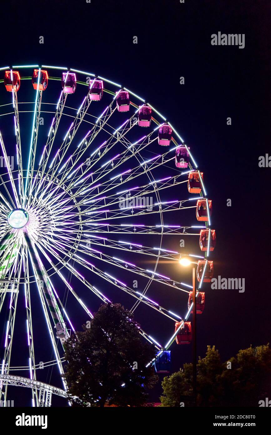 neon carnival amusement park ride lights at night Stock Photo - Alamy