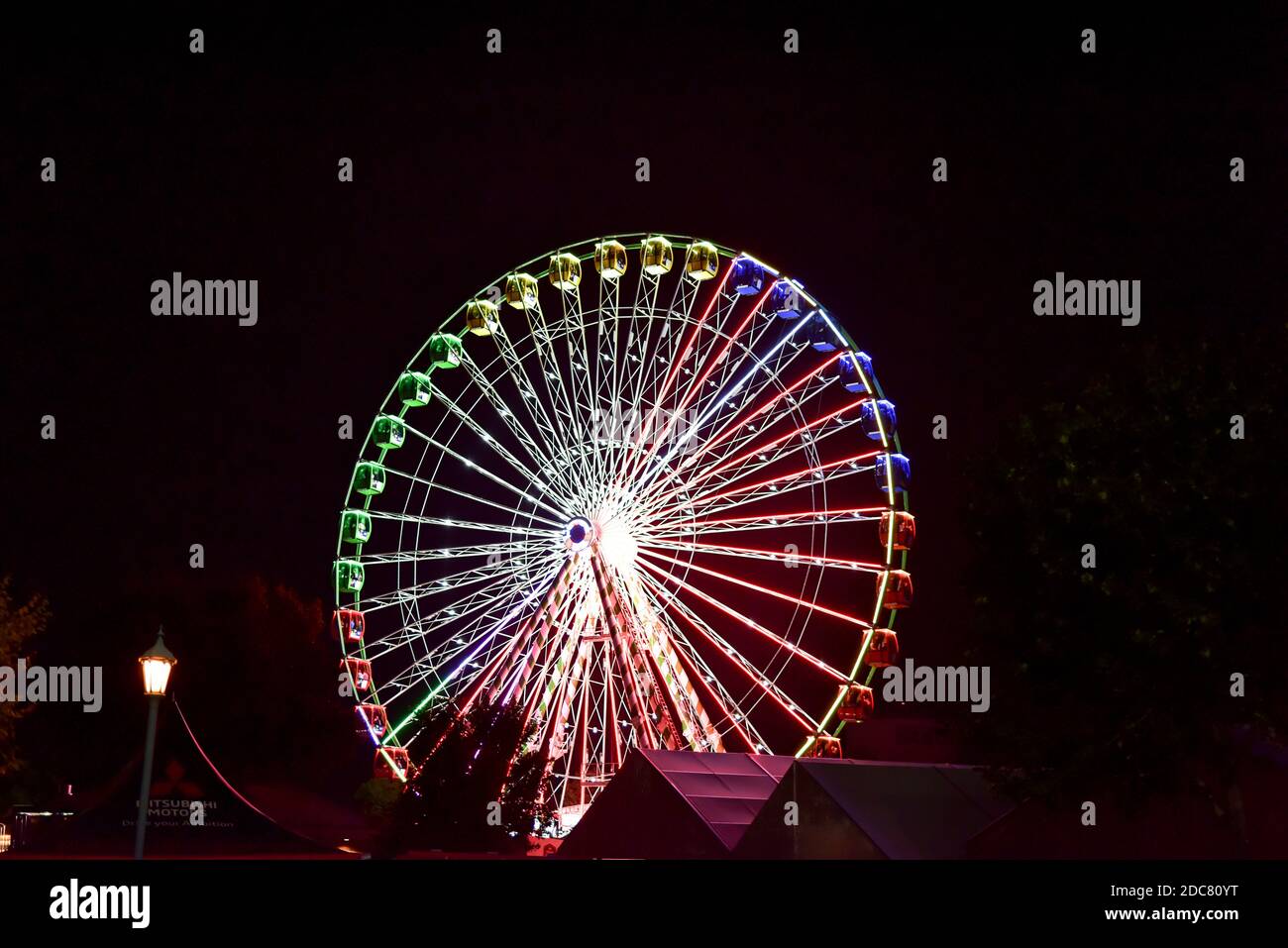 neon carnival amusement park ride lights at night Stock Photo - Alamy