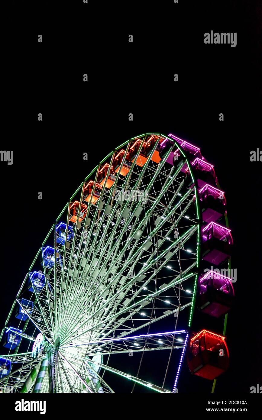 neon carnival amusement park ride lights at night Stock Photo - Alamy