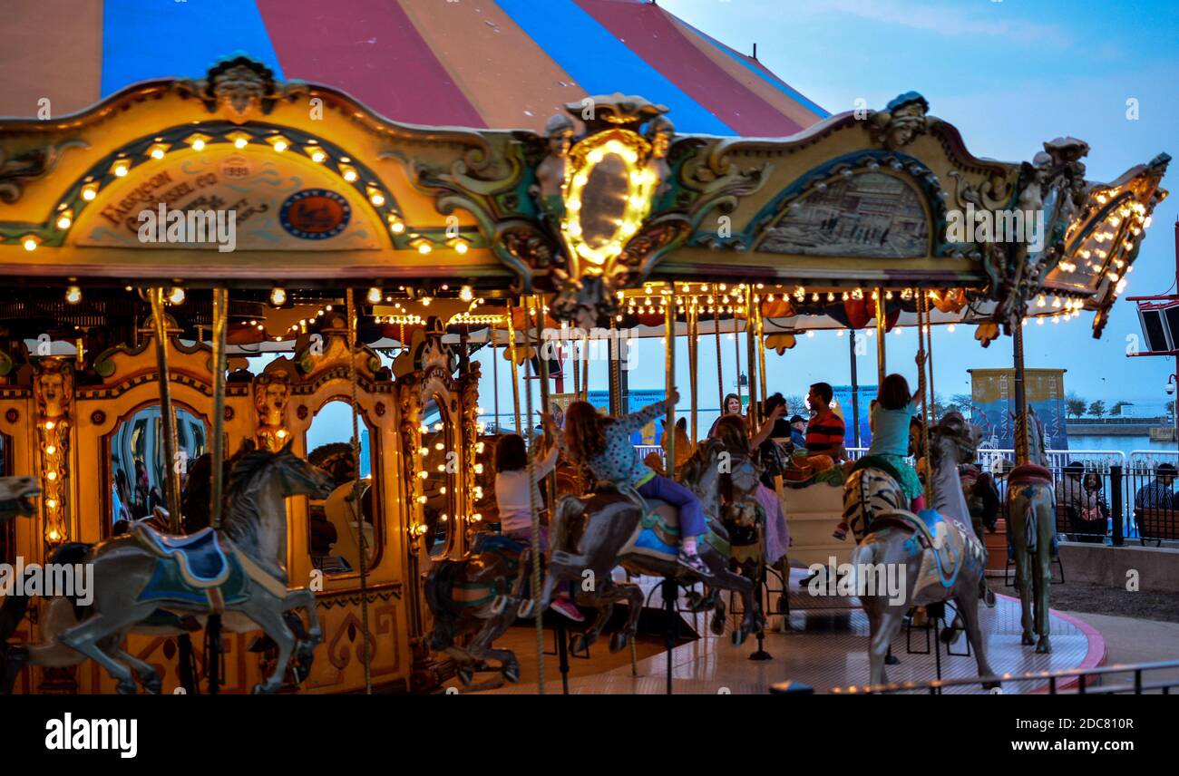 neon carnival amusement park ride lights at night Stock Photo - Alamy