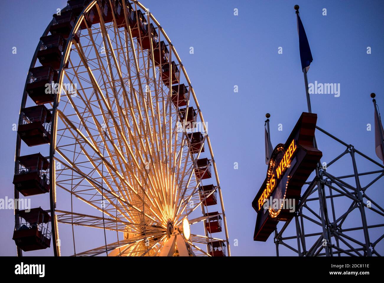 neon carnival amusement park ride lights at night Stock Photo - Alamy