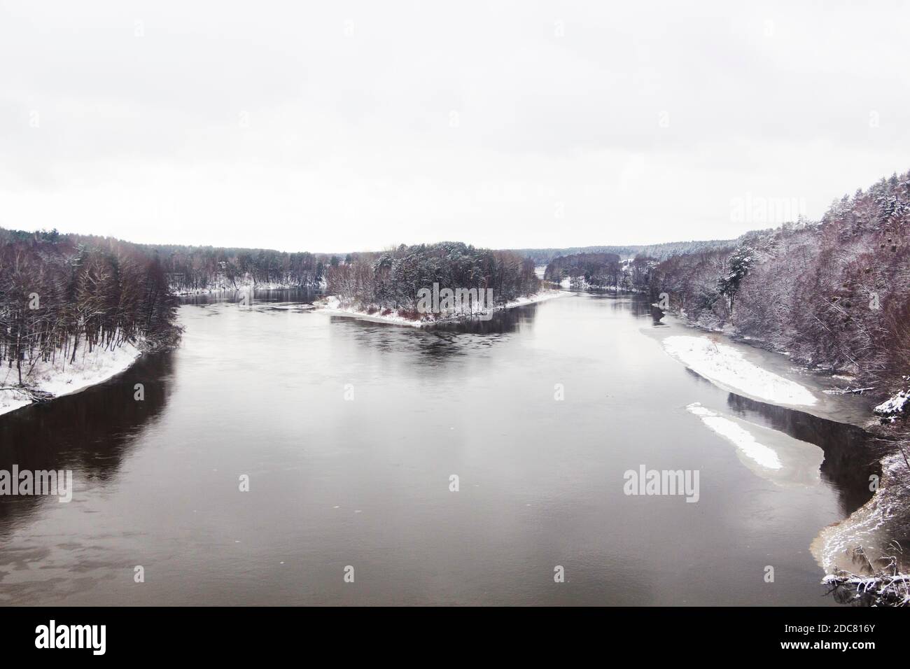 the big river is surrounded by forest. in winter. much snow Stock Photo ...