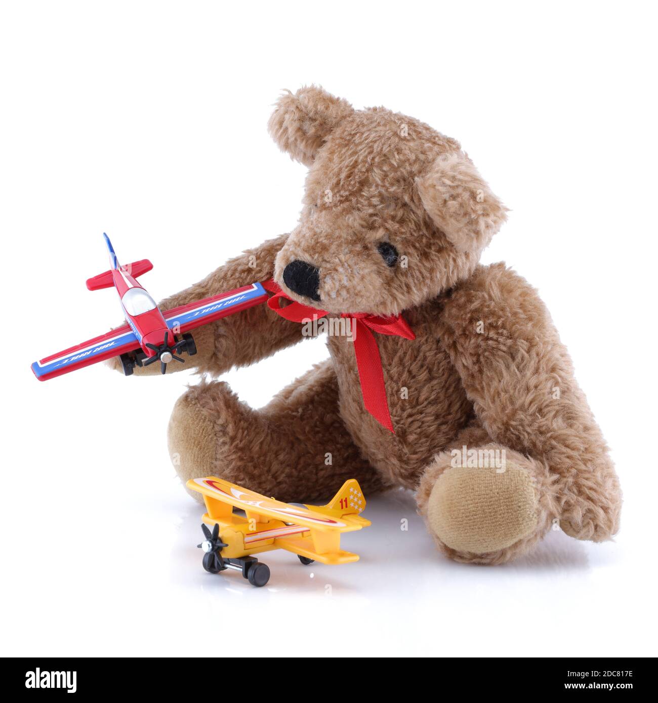 Small cute teddy playing with toy planes Stock Photo - Alamy