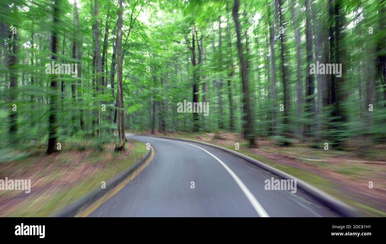Low angle view of empty highway road in the country under blue sky and ...