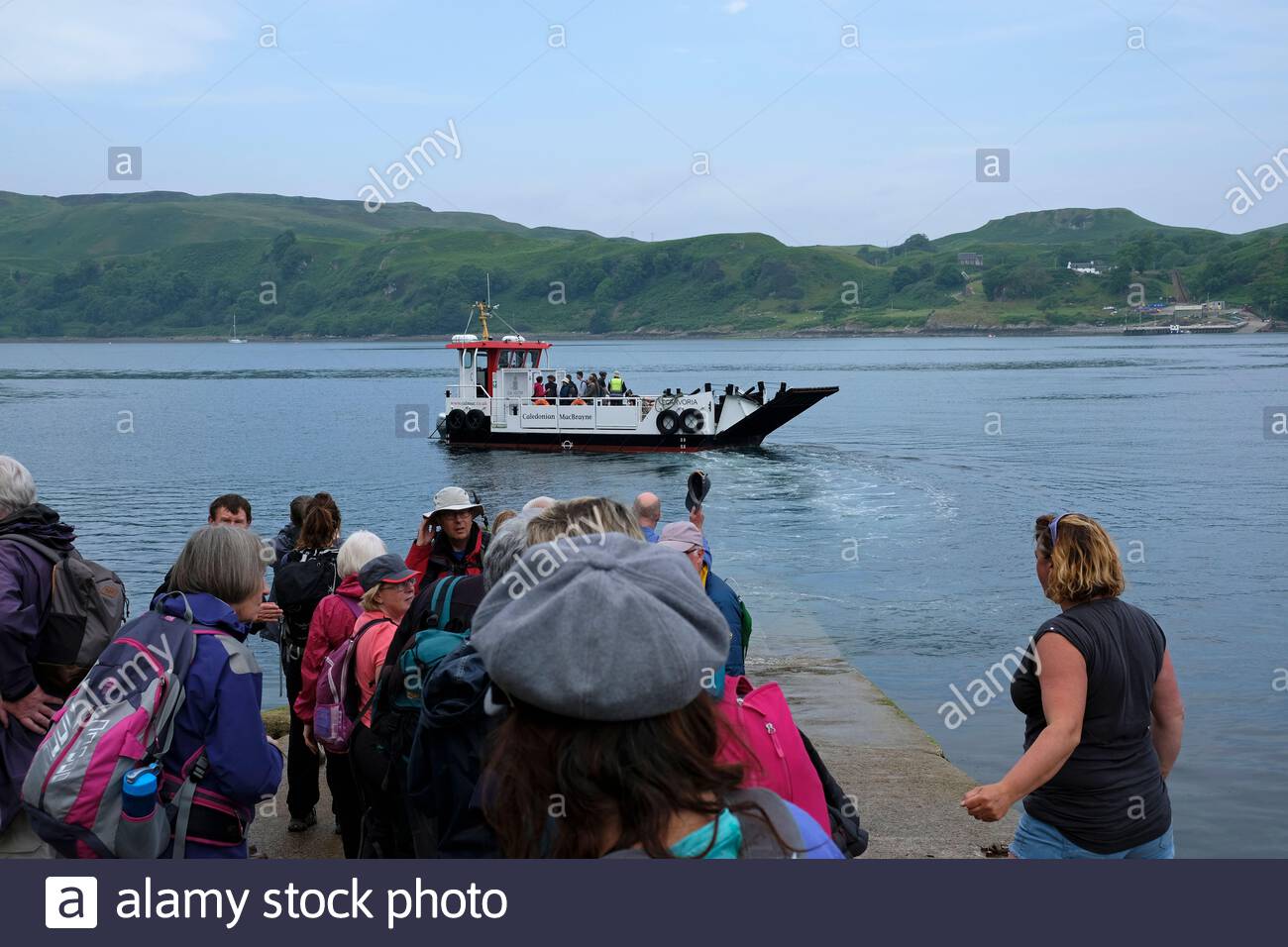 People on the Caledonian MacBrayne ferry Carvoria, being ferried across ...