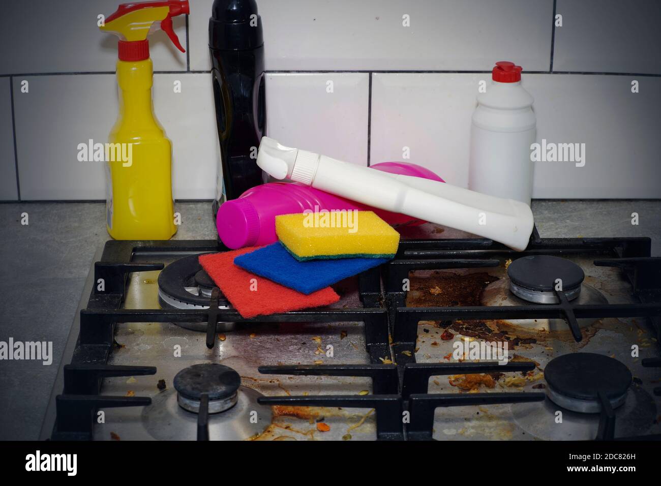 Dirty, top of the gas stove with bits of food. House cleaning Stock ...