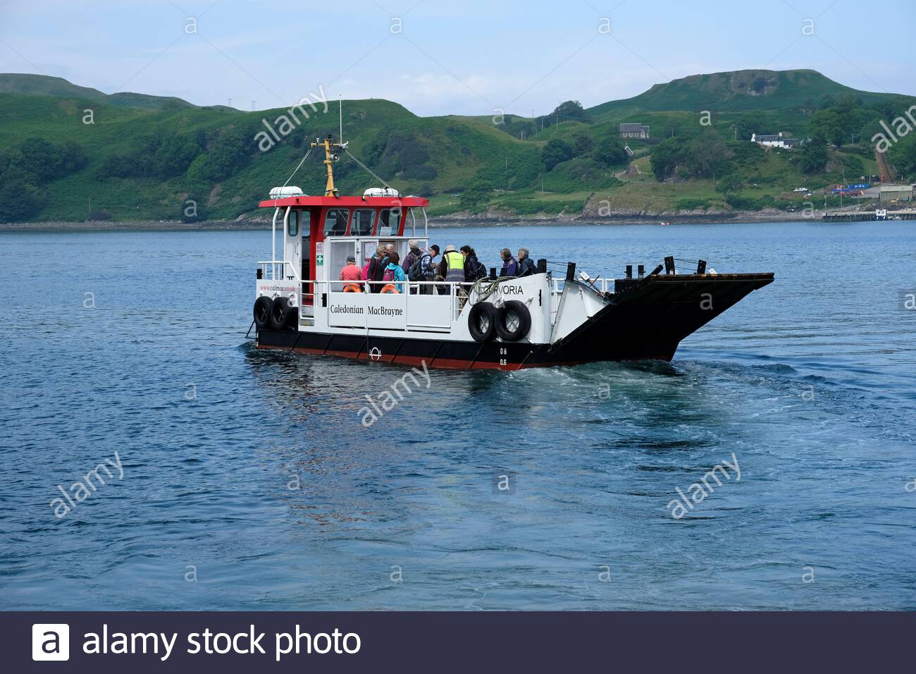 People on the Caledonian MacBrayne ferry Carvoria, being ferried across ...