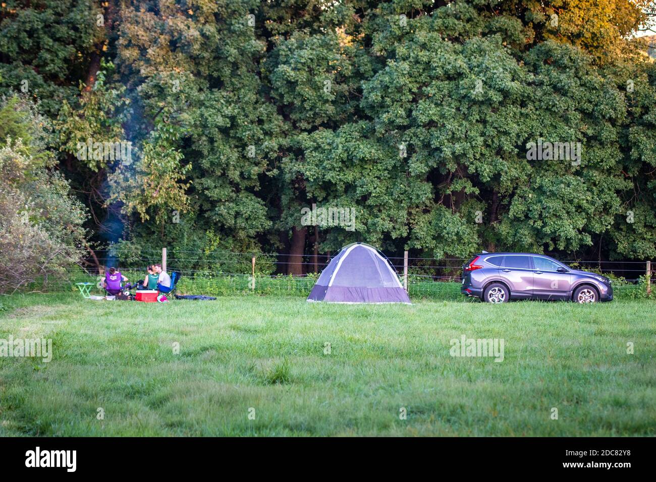 Hipcamp campers hanging out tent camping in farm fields on the weekend ...
