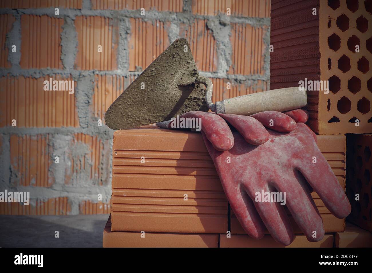 Mason bricklaying background with trowel and clay brick blocks Stock ...