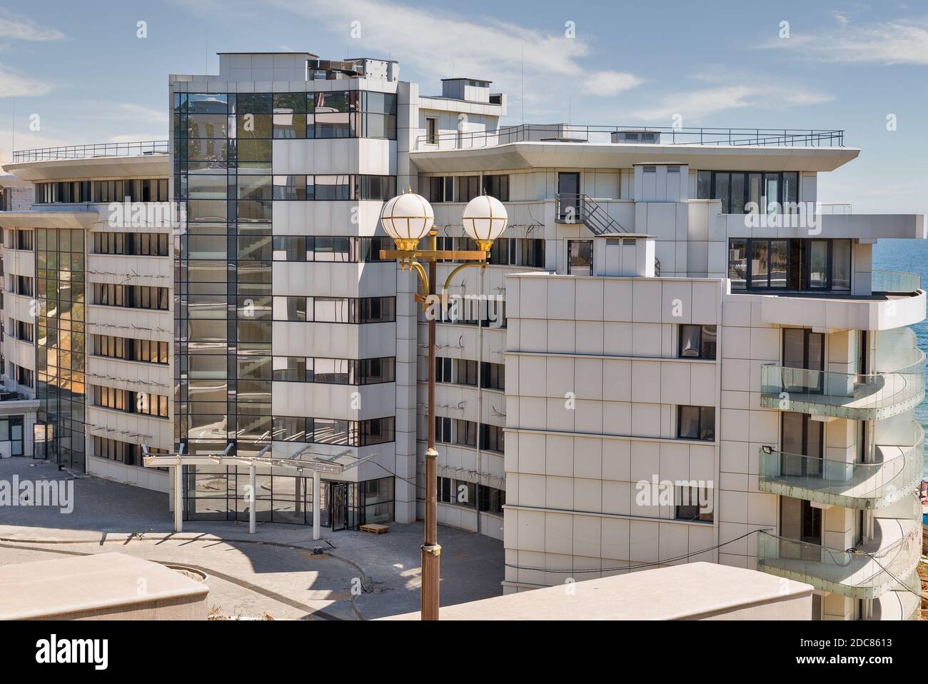 Modern office and residential building construction on sea shore Stock ...