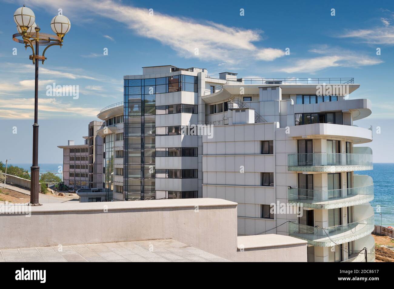 Modern office and residential building construction on sea shore Stock ...