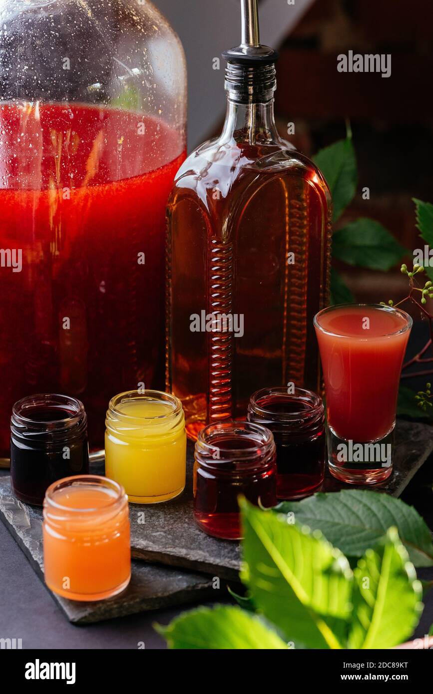 berry alcoholic tinctures in shorts Stock Photo - Alamy