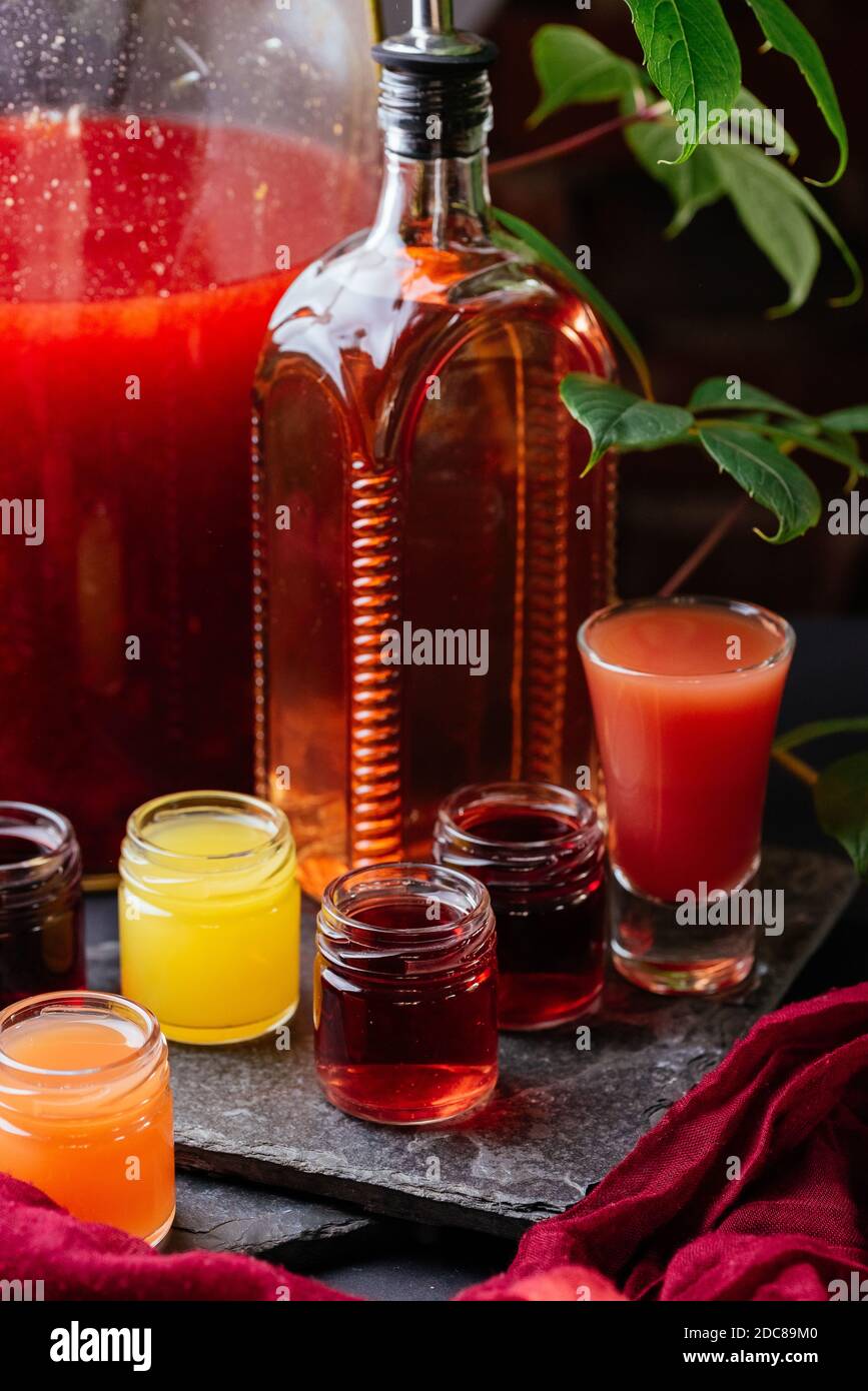 berry alcoholic tinctures in shorts Stock Photo - Alamy