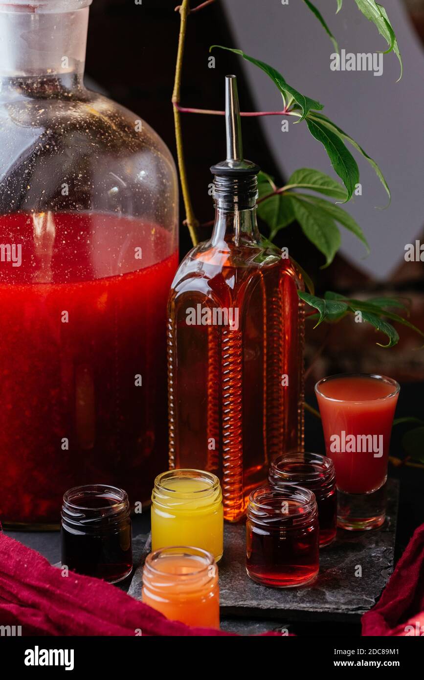 berry alcoholic tinctures in shorts Stock Photo - Alamy