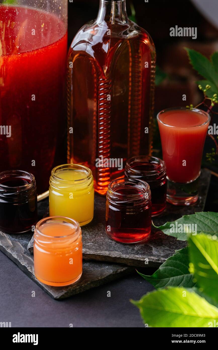 berry alcoholic tinctures in shorts Stock Photo - Alamy