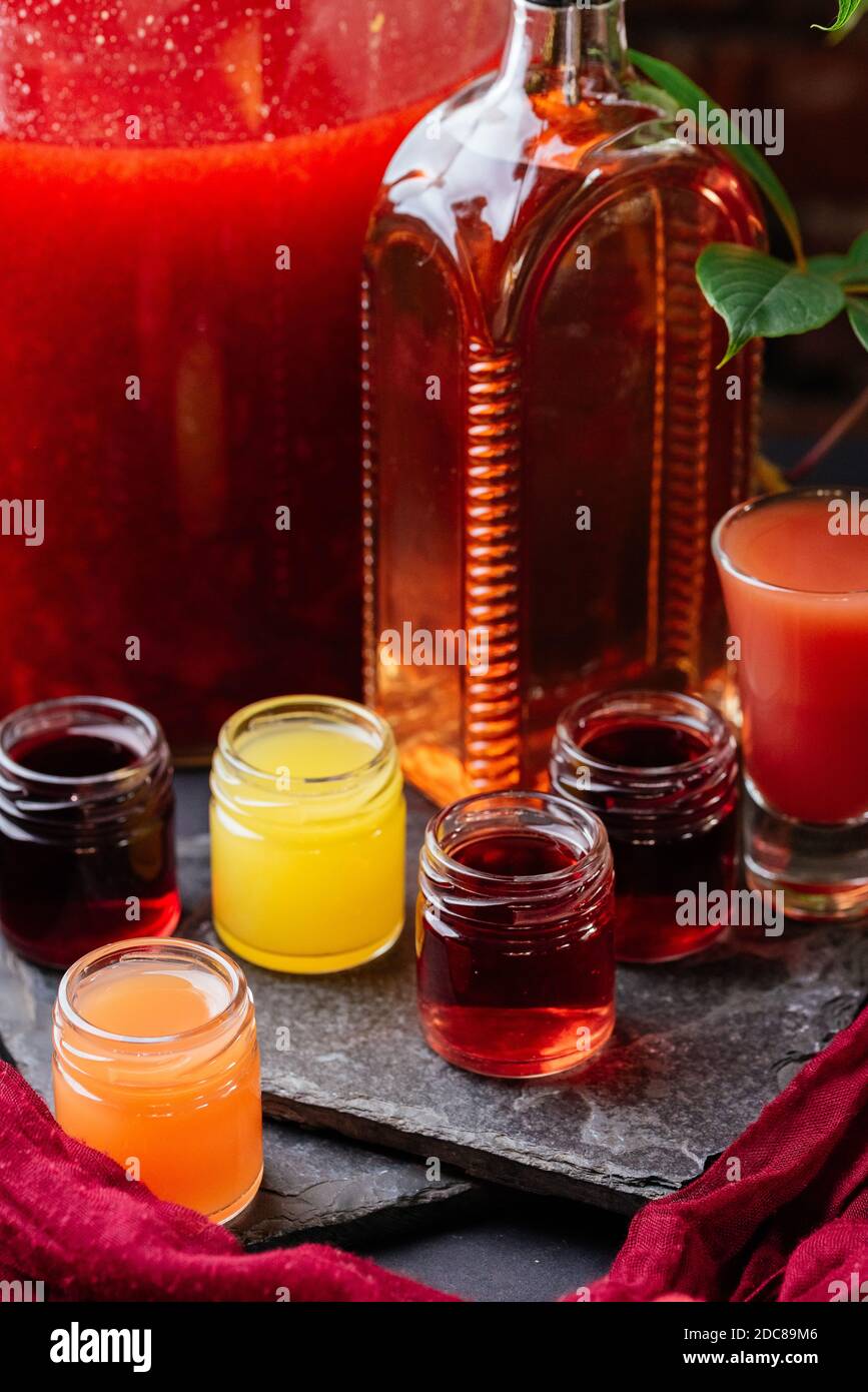 berry alcoholic tinctures in shorts Stock Photo - Alamy