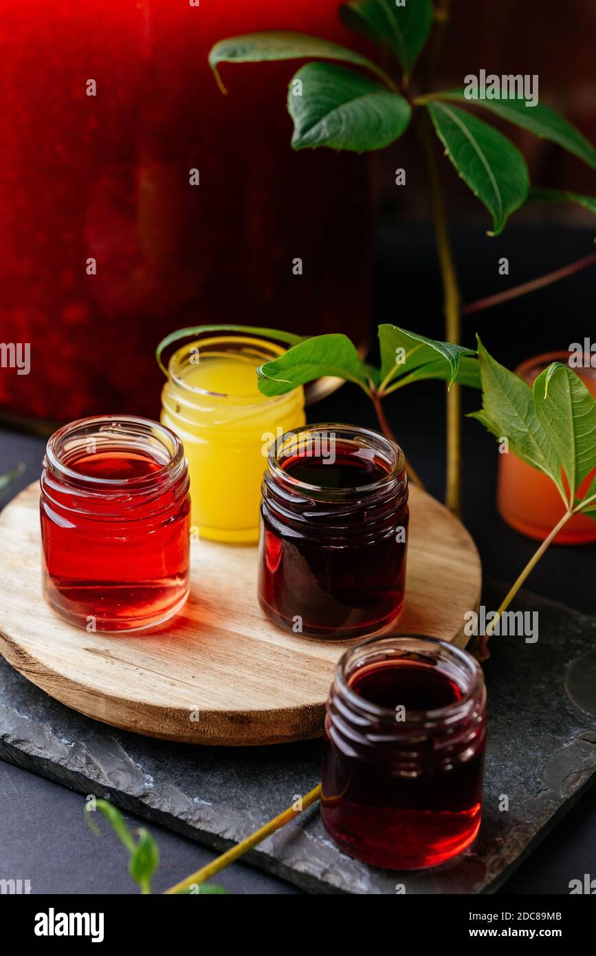 berry alcoholic tinctures in shorts Stock Photo - Alamy