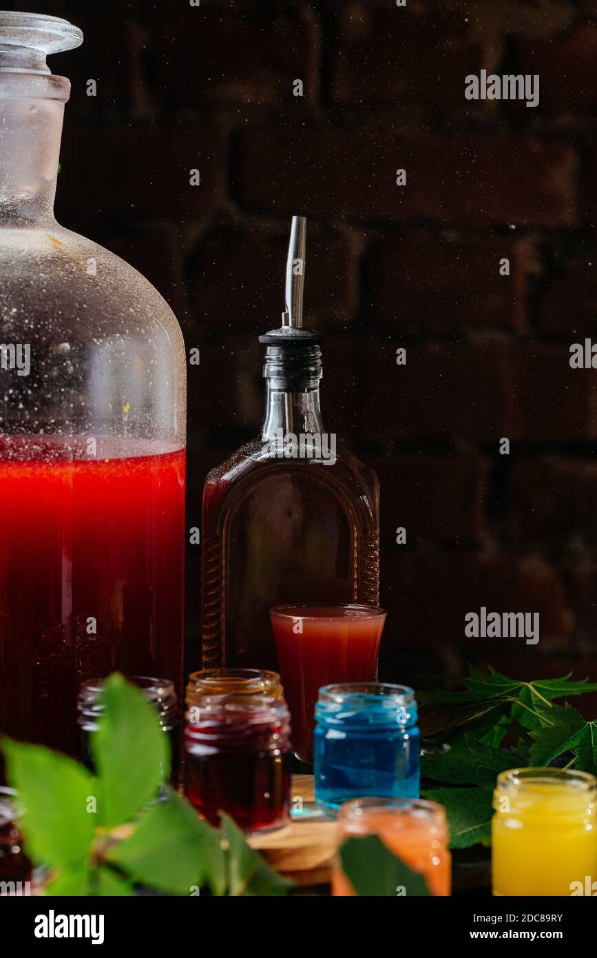 berry alcoholic tinctures in shorts Stock Photo - Alamy