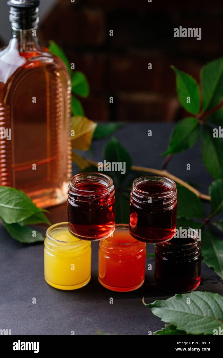 berry alcoholic tinctures in shorts Stock Photo - Alamy