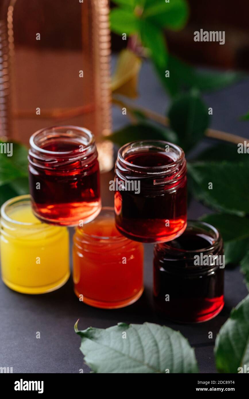 berry alcoholic tinctures in shorts Stock Photo - Alamy