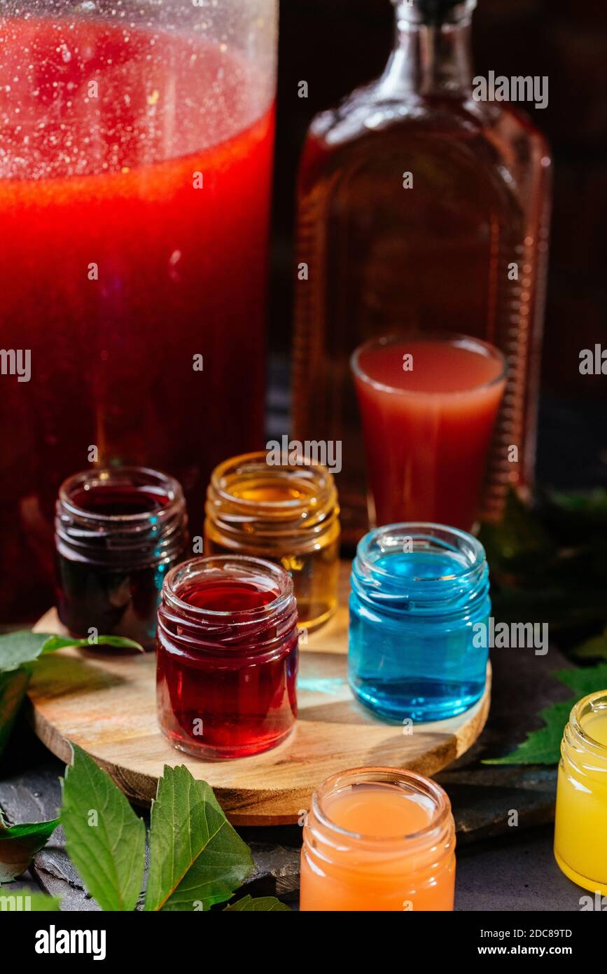 berry alcoholic tinctures in shorts Stock Photo - Alamy