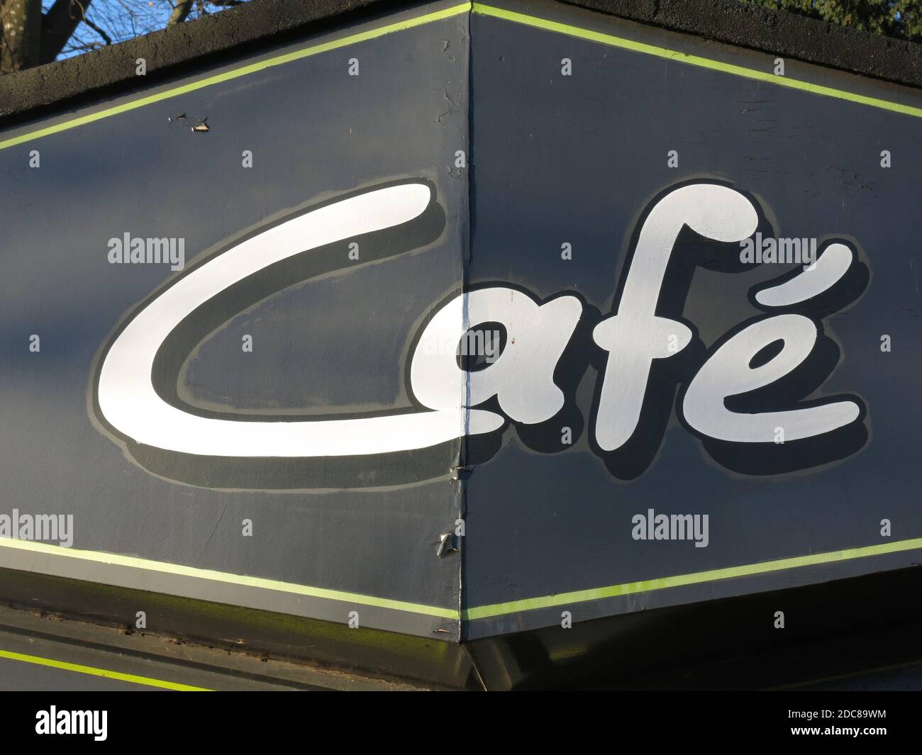The word "Cafe" in white and black script on a grey diamond-shaped ...