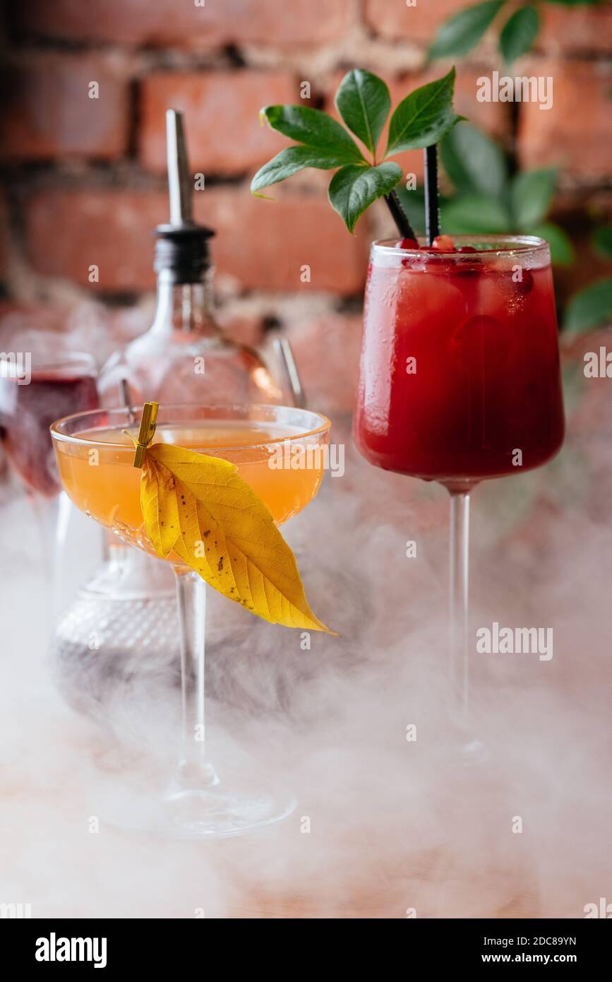 autumn cocktails on a brick wall background Stock Photo - Alamy