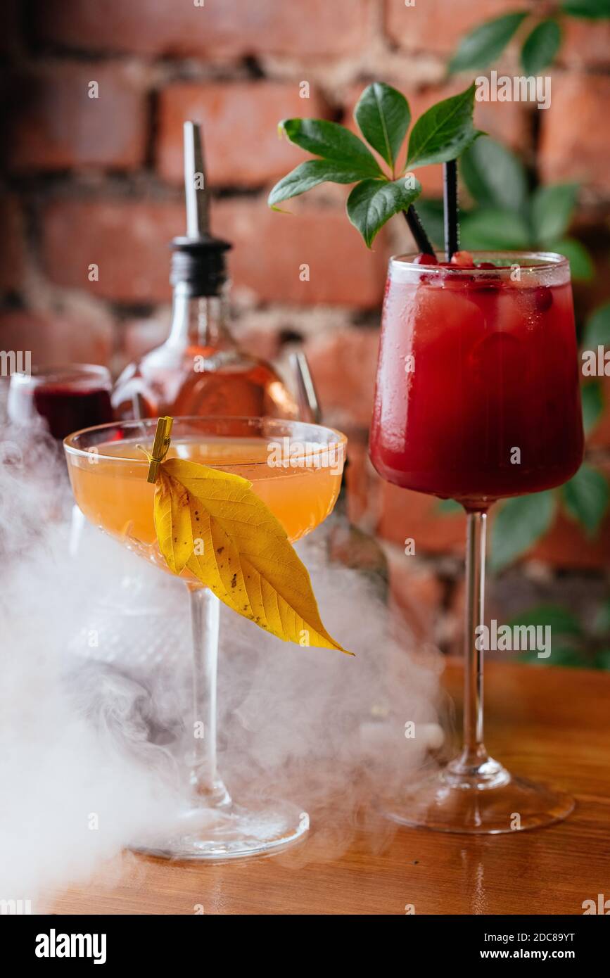 autumn cocktails on a brick wall background Stock Photo - Alamy