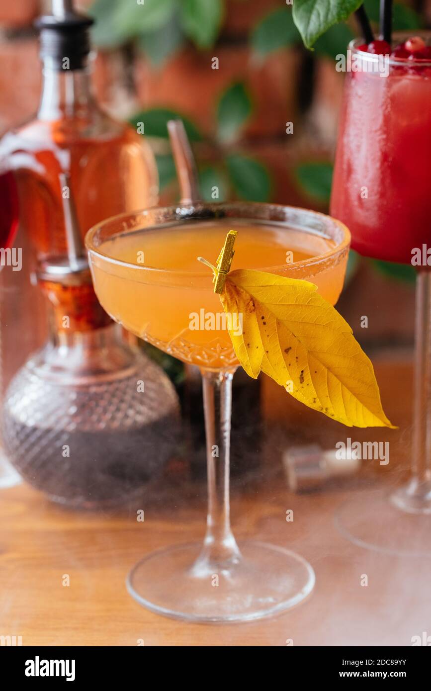 autumn cocktails on a brick wall background Stock Photo - Alamy