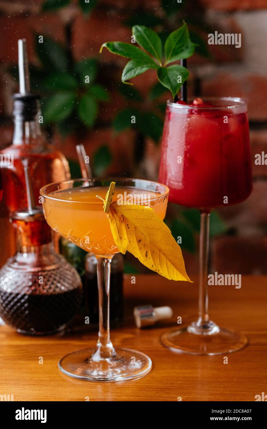 autumn cocktails on a brick wall background Stock Photo - Alamy