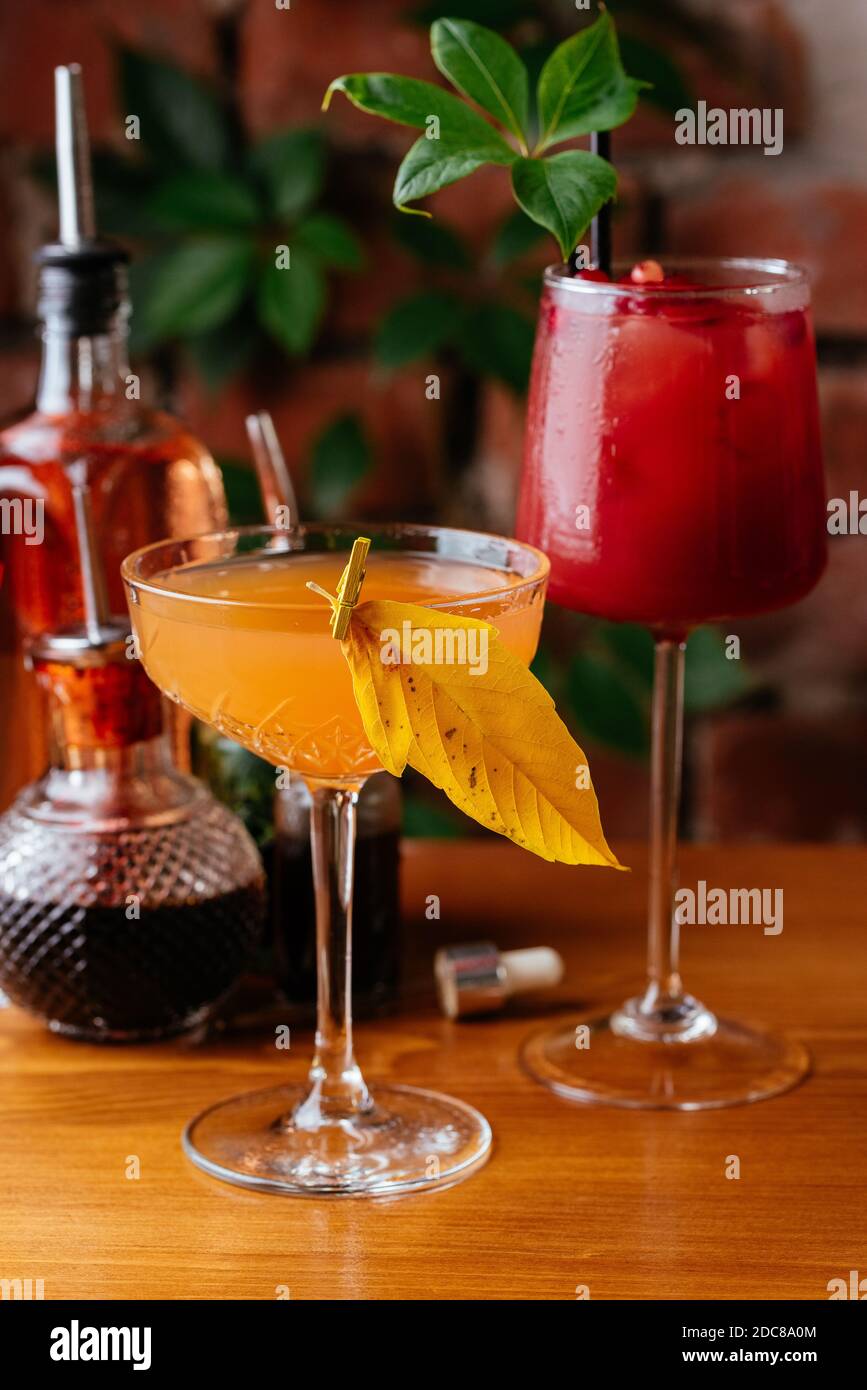 autumn cocktails on a brick wall background Stock Photo - Alamy