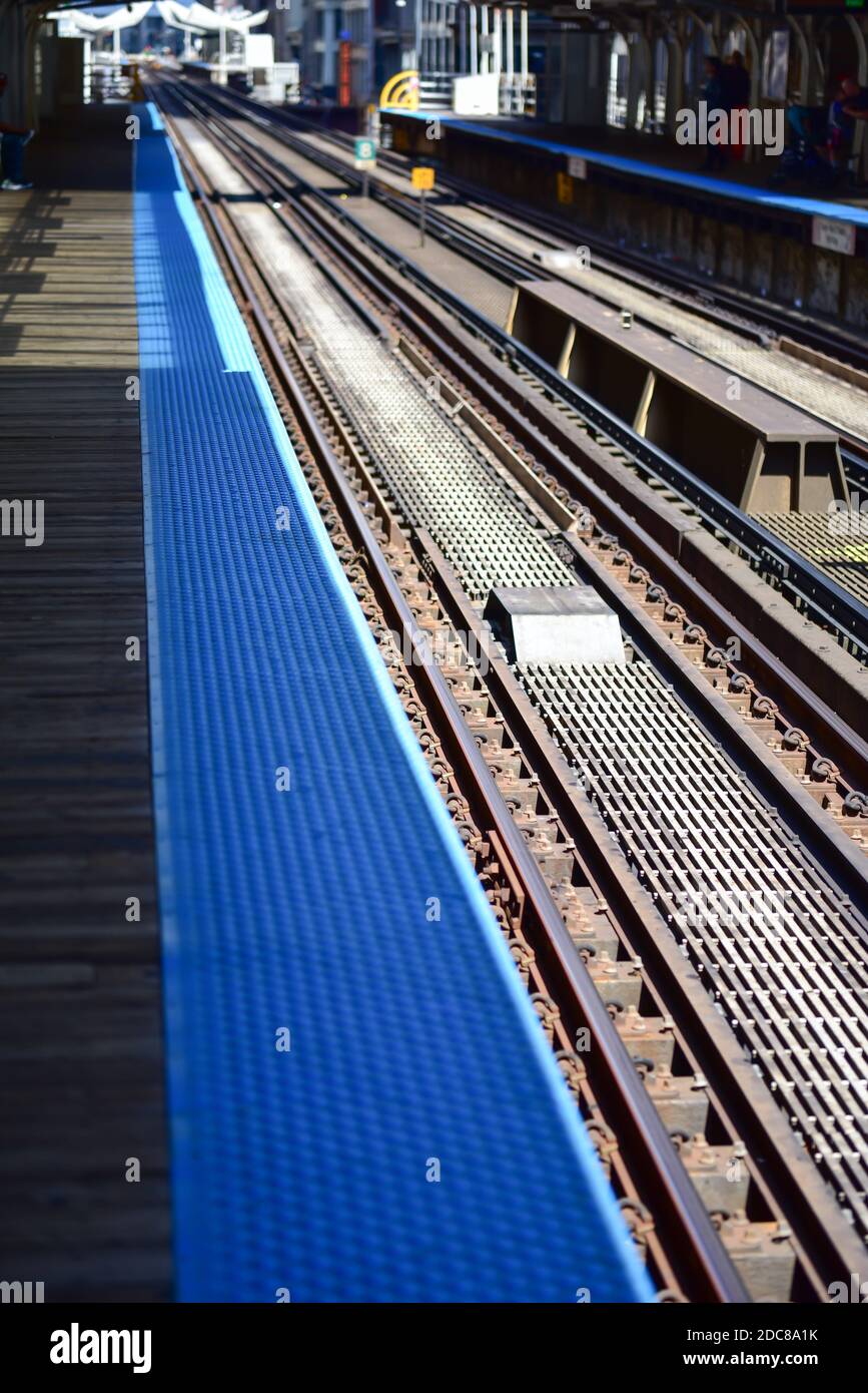 empty subway commuter train tracks in the big city Stock Photo - Alamy
