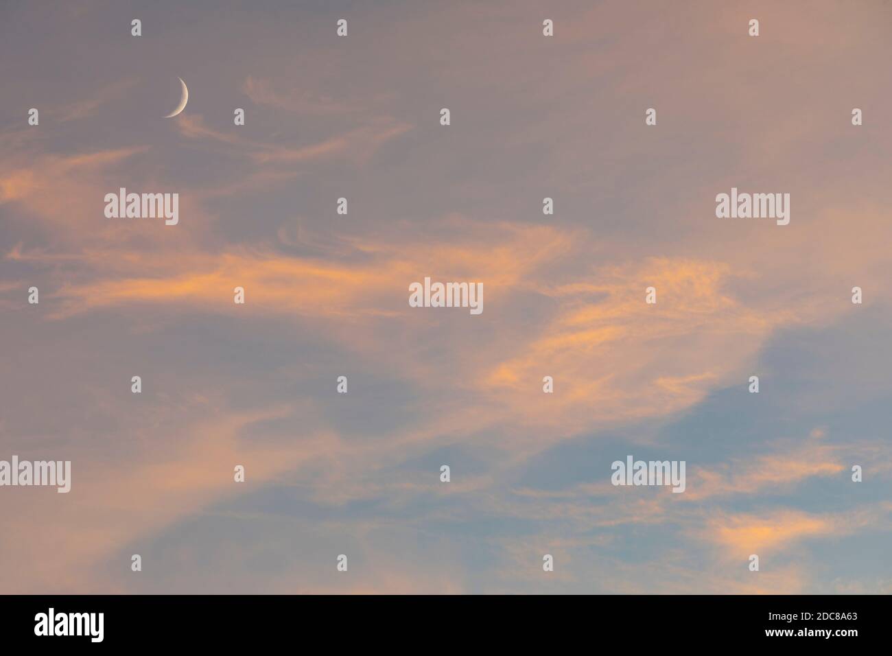 High clouds (cirrus) and crescent moon at sunset Stock Photo - Alamy