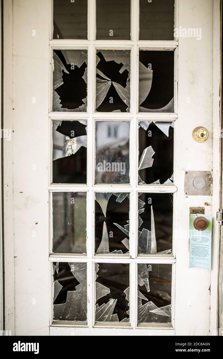 Close-up of shattered glass in a paned door of an abandoned house Stock ...