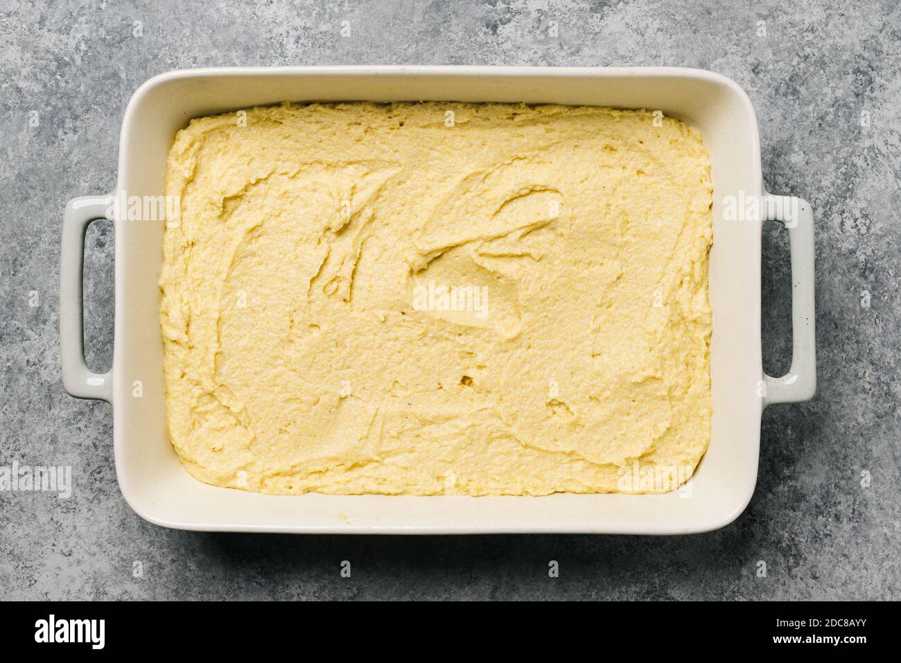 Baking tray with raw cornbread batter Stock Photo - Alamy