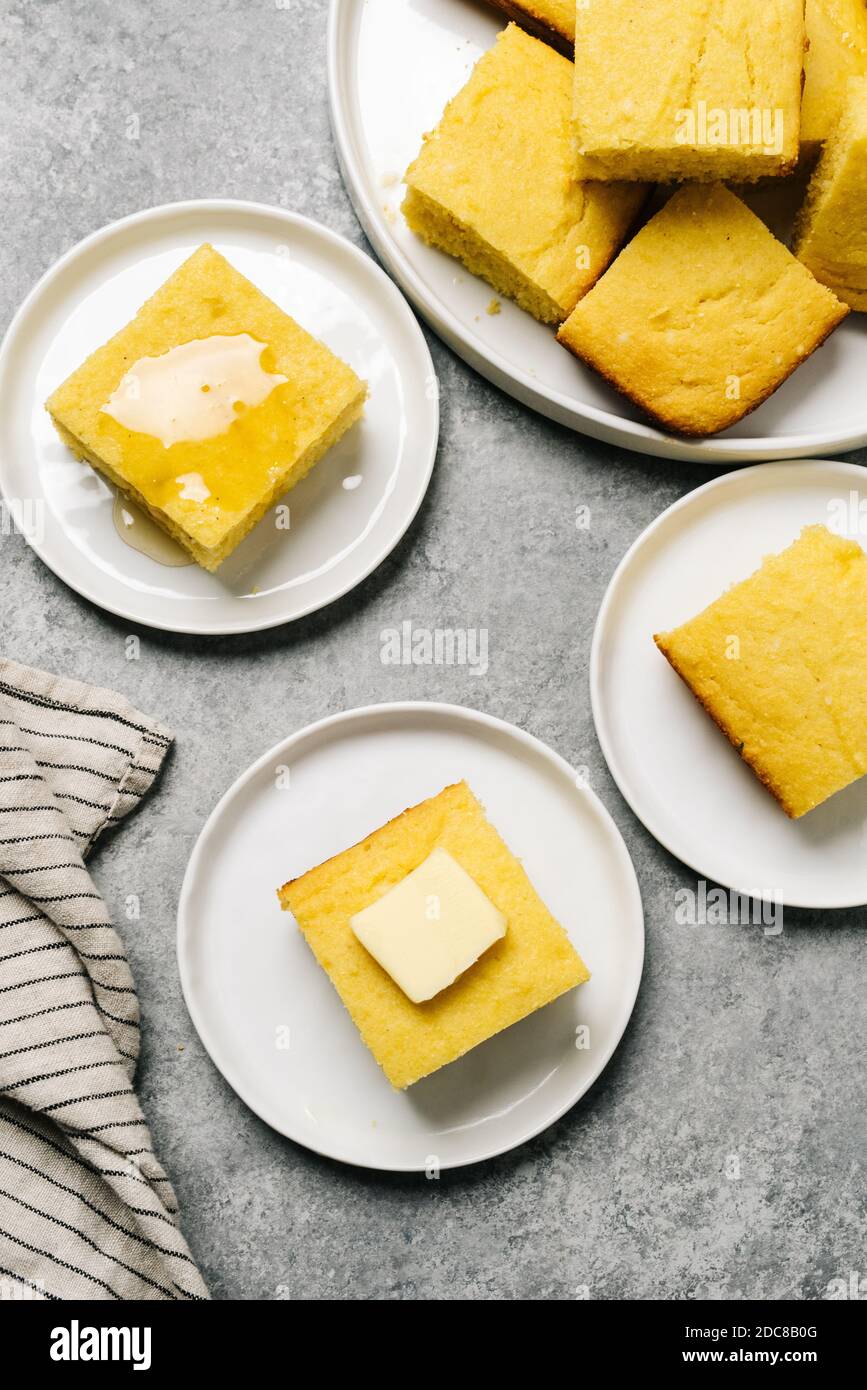 Cornbread squares served on small plates Stock Photo - Alamy