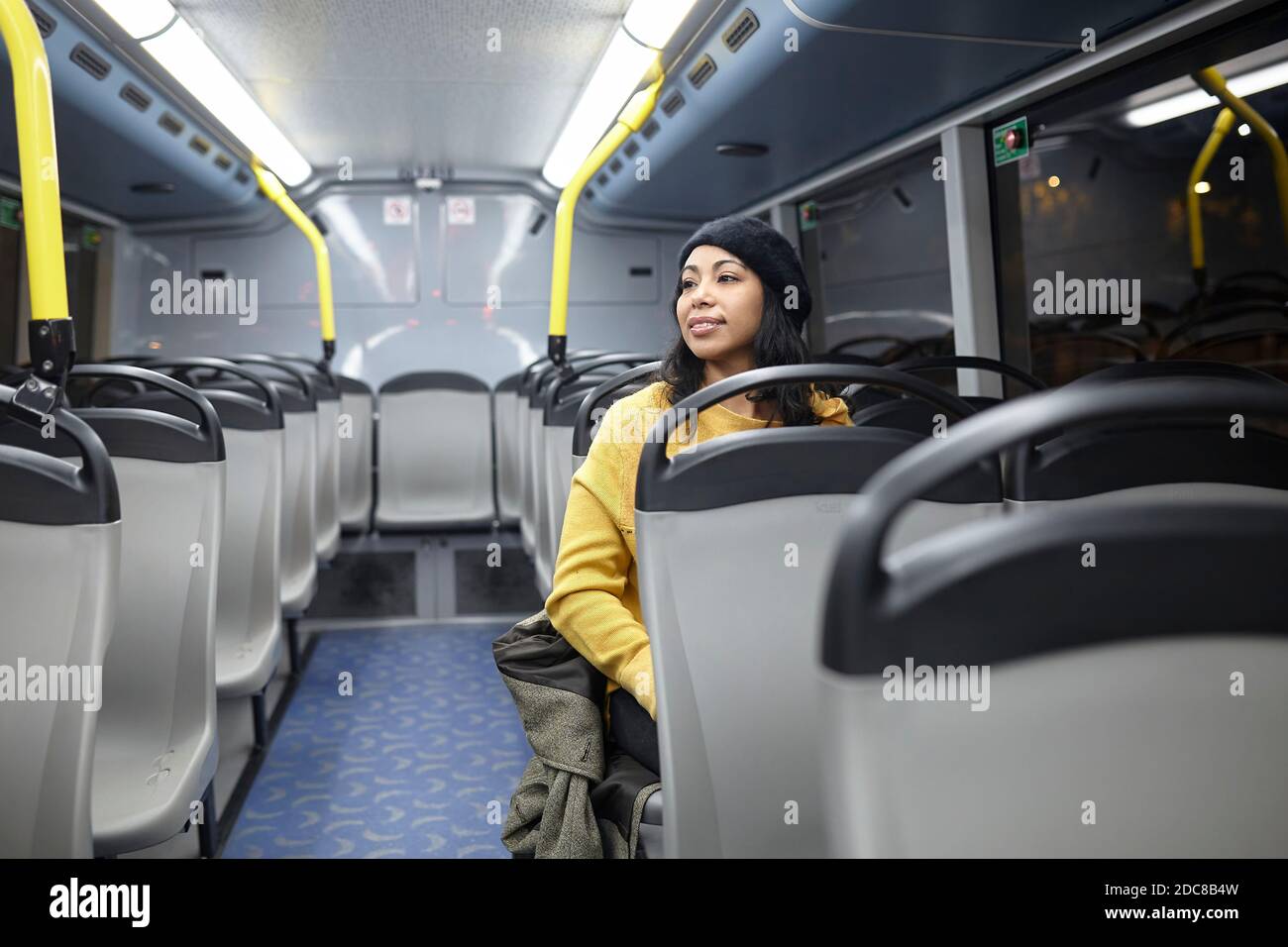 Hispanic Woman In A Transport Public, At Night Stock Photo - Alamy