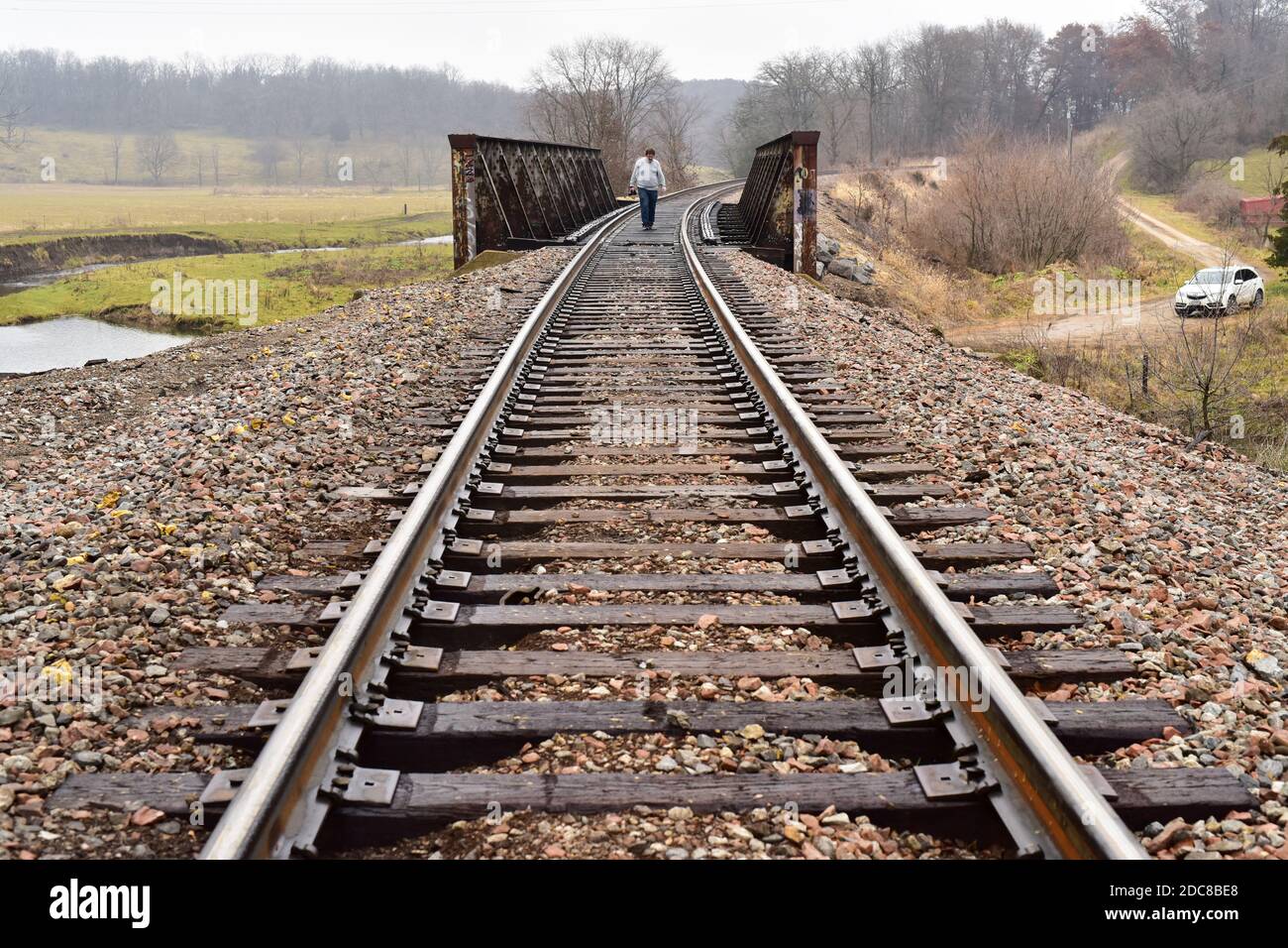 Empty freight train railway tracks winding through the rural ...