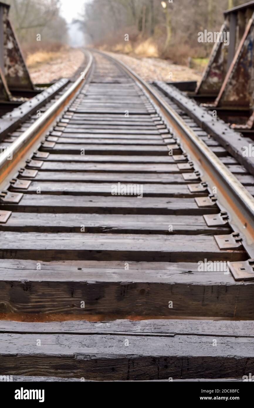 Empty freight train railway tracks winding through the rural ...
