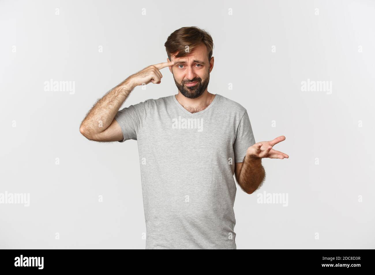 Portrait of frustrated guy scolding someone for being crazy or strange ...