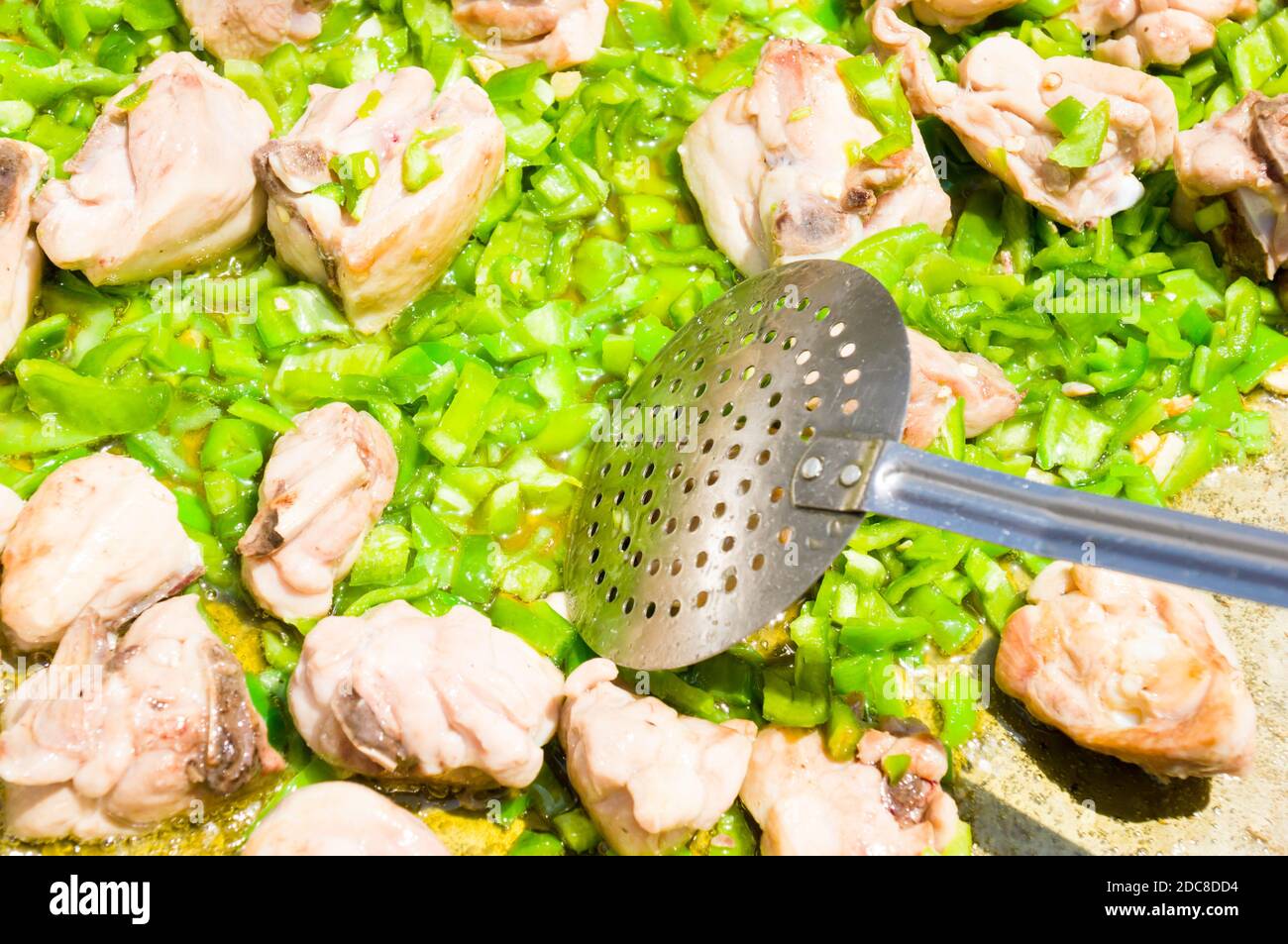 The process of cooking paella, typical Spanish food Stock Photo - Alamy